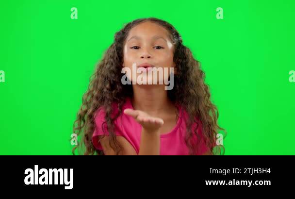 Green screen, studio and child blowing a kiss for love, care and ...