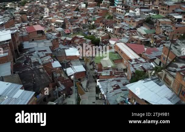 Medellin, Colombia, drone aerial view of Comuna 13 slums. Once one of ...