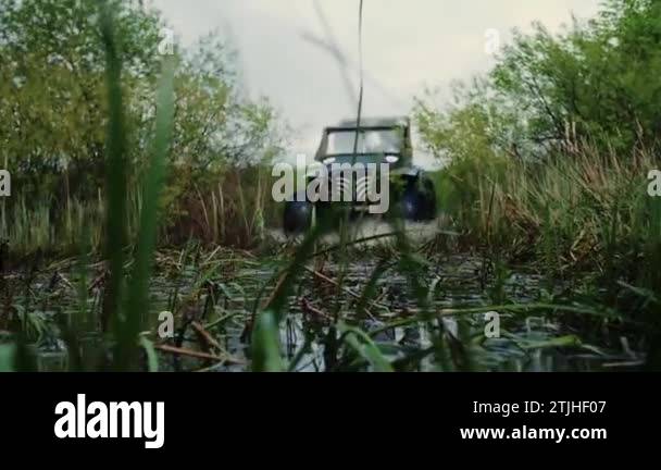 Riding Off road 4x4 Car Driving into the river.Swamp buggy on wheels ...