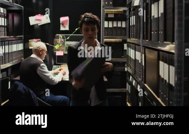 Agents browsing through case file, trying to find new crucial ...