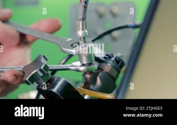 Repair of car injectors close-up. Disassembly of the nozzle and ...