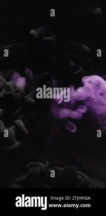 Vertical video. Ink water shot. Fume cloud. Underwater dye blast ...