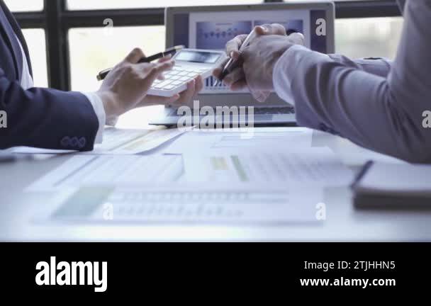 Group of business men and women holding statistical data and charts of ...