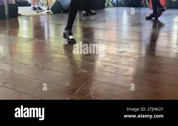 Young girl in black and silver shoes and clothing doing a solo ...