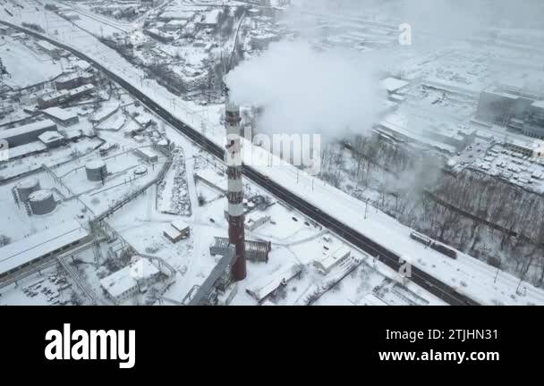 Flight over an industrial area with a loading dock with barges and taps ...