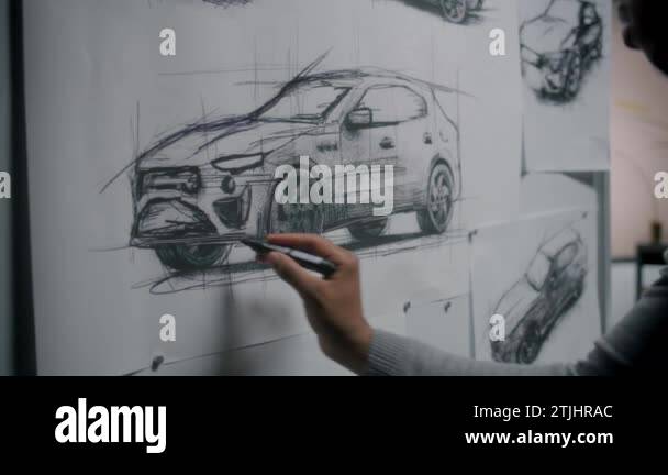 Automotive african american male designer drawing sketch blueprint with ...