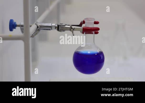 Mixing colored solution with a magnetic stirrer. Formation of a ...