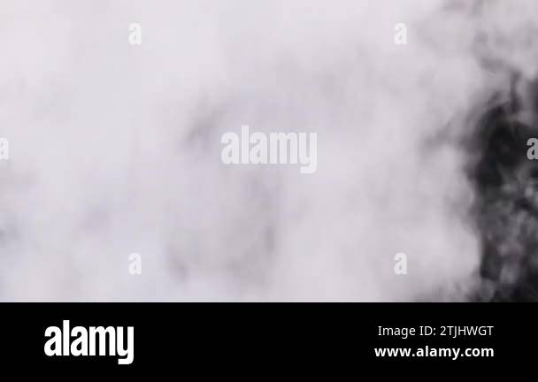 White smoke on black background. A cloud of vapor steam rises up ...