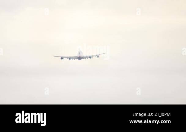 Passenger huge widebody aircraft flying away. Jumbo jet departure, long ...