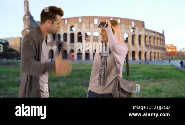 Tourist couple in Rome having conversation. Attractive man and woman by ...