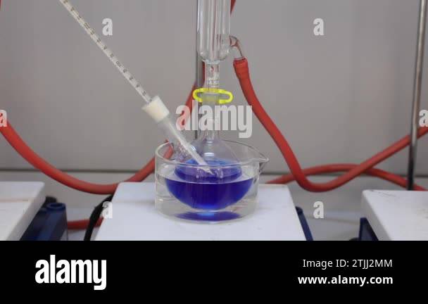 Mixing colored solution with a magnetic stirrer. Formation of a ...