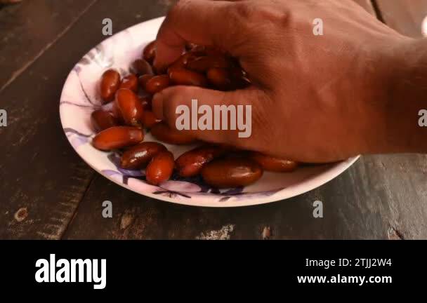Date palm fruits. Its other names Phoenix dactylifera. Itis a flowering ...