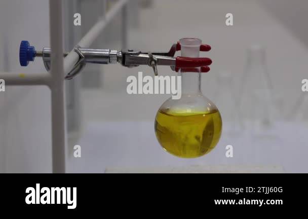 Mixing colored solution with a magnetic stirrer. Formation of a ...