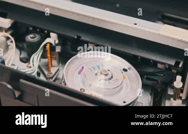 VHS video tape putting inside a VCR recorder and plays. Vintage VHS ...