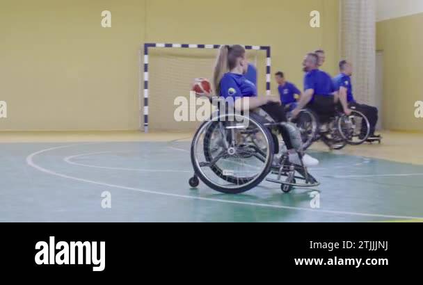 Wheelchair Basketball Game: Players Compete, Dribbling Ball, Passing ...