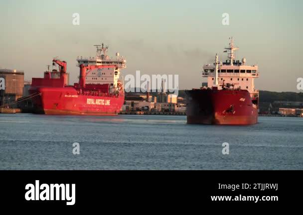 A containerized cargo ship enters the port for unloading, A ...