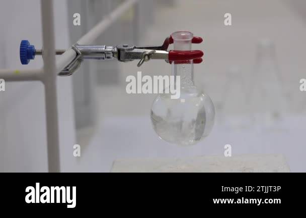 Mixing colored solution with a magnetic stirrer. Formation of a ...