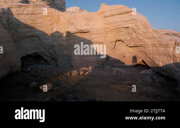 Little shadow of loving woman hugging man and leaving on huge rocks at ...