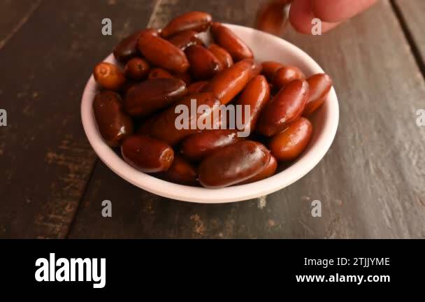 Date palm fruits. Its other names Phoenix dactylifera. Itis a flowering ...
