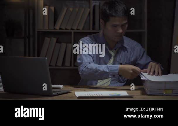 business people work overtime Businessman hard working with desktop ...