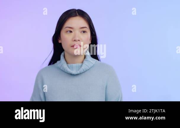 Asian woman, thinking and anxiety on face with worried, fear and ...