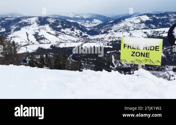 Yellow symbol with warning about free ride zone on ski resort in winter ...