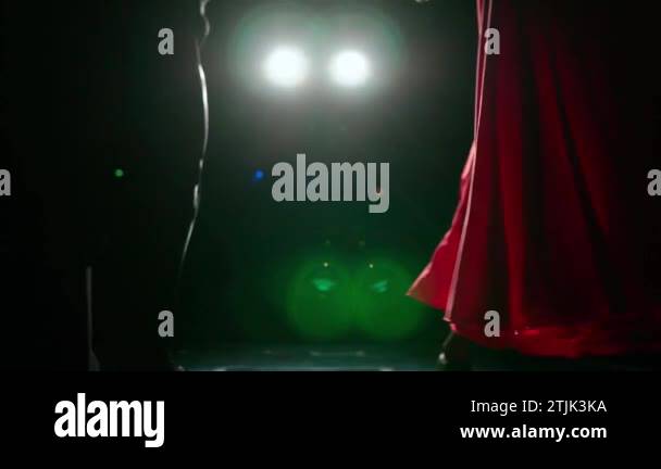 Ballroom dancers slowly coming out on stage holding hands across and ...