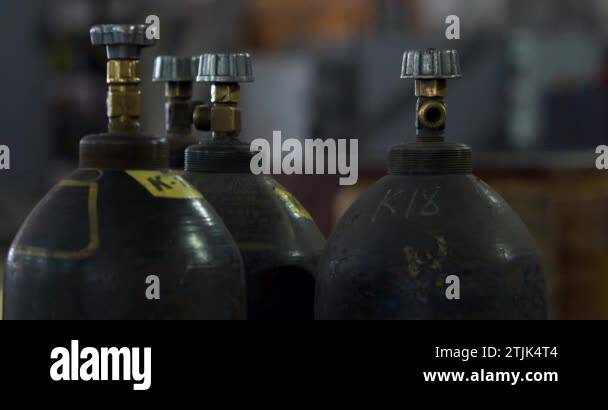 Black oxygen cylinders for welding and industry. Oxygen cylinder with ...