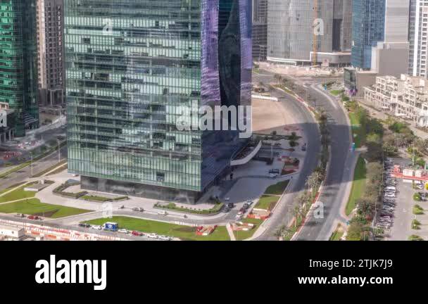 Business Bay Dubai skyscrapers with traffic on a road intersection ...