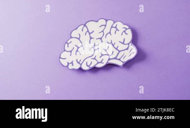 Video of purple and white paper brain on purple background with copy ...
