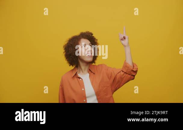 Female Point Finger Up Gesture On Yellow Background, Woman Showing Copy ...