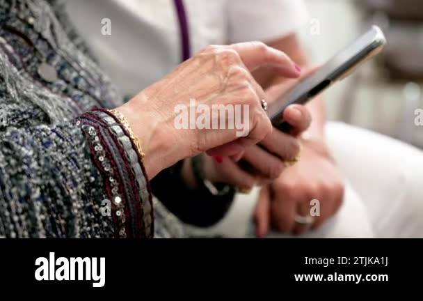 Nurse teaching elder woman how to use mobile phone, senior grandmother ...