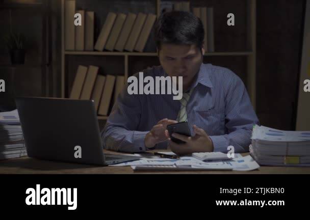 business people work overtime Businessman hard working with desktop ...