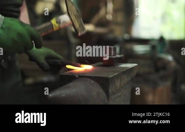 A blacksmith, creating objects from wrought iron or steel by forging ...