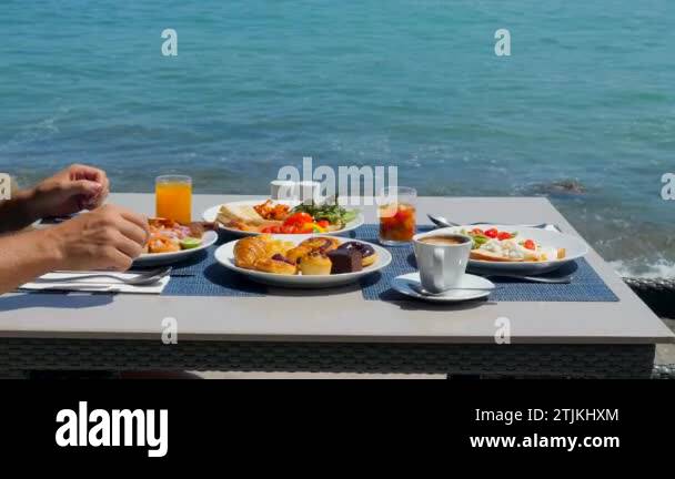 Tasty buffet breakfast served on table in luxury restaurant with sea ...