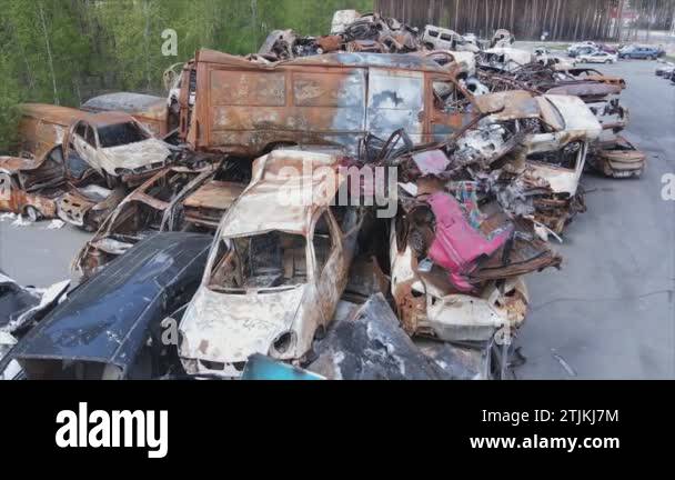 This stock video shows a dump of shot and burned cars in Irpin, Bucha ...