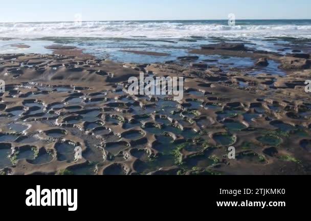 Eroded rock formation, tide pool in La Jolla, California coast, USA ...