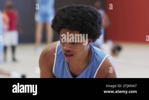 Happy african american male basketball player spinning ball on finger ...