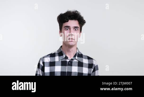 A curly-haired Caucasian man on white background, he stands, his body ...