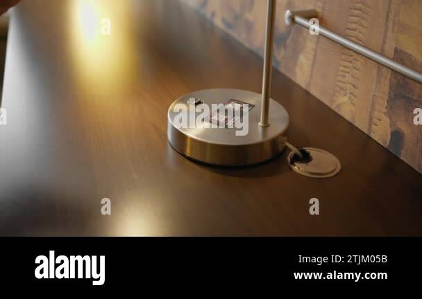 a man in a luxury hotel room holds a smartphone and scans a code view ...