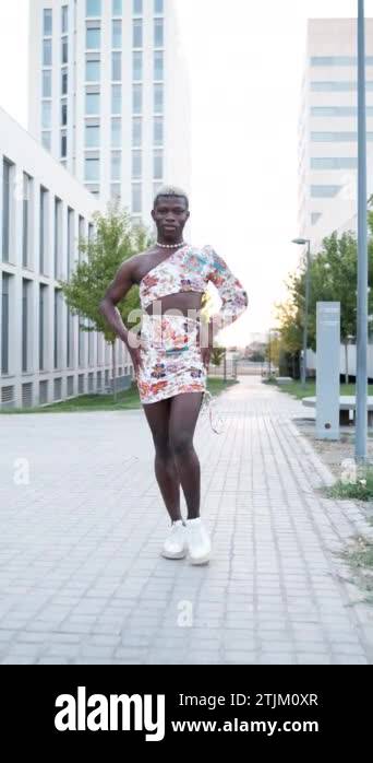 Full body of confident young muscular African American transgender man ...