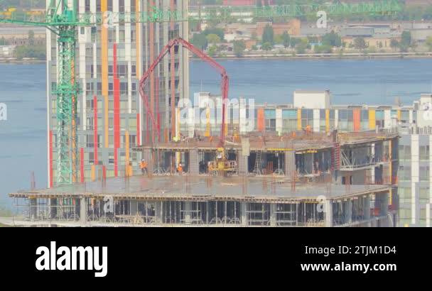 Work at the construction site of a multi-storey building. Workers build ...