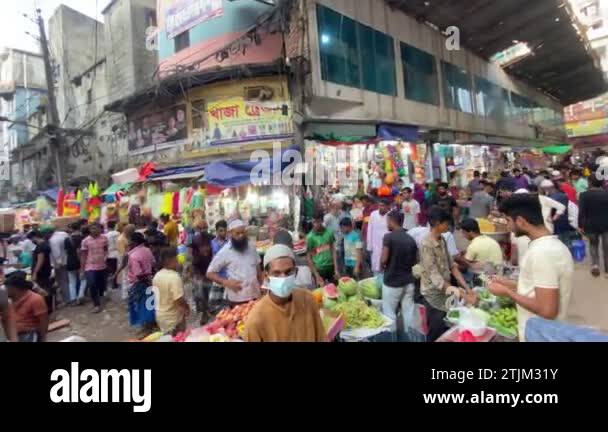 Crowded fruit and food market at Chawk Bazaar, Dhaka, Bangladesh. Panning wide shot Stock Video ...