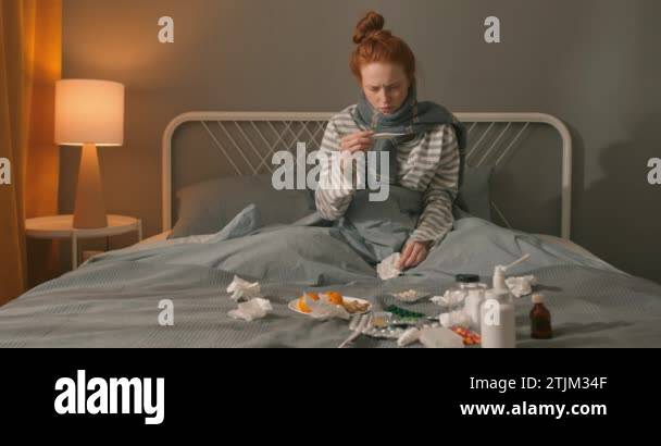 red-haired sick, flu-ridden young woman has problems with health ...