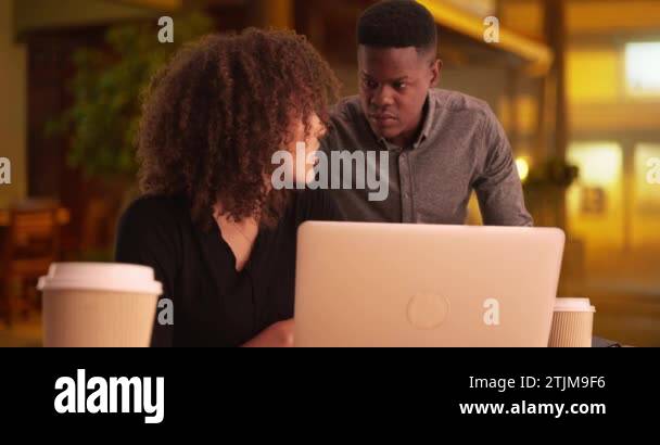 Two black professionals working outside their office. African American ...