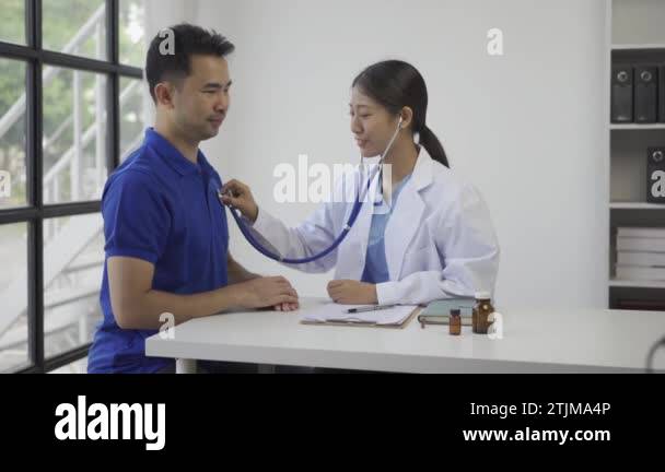 Doctor checking patient's respiratory rate or pulse rate by using ...