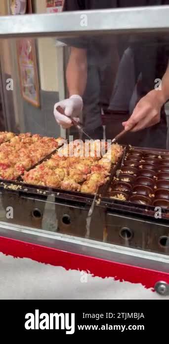 Unrecognizable vendor cooking Takoyaki at Osaka, Japan. Asian street ...