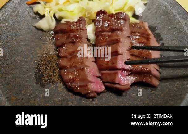 Thick beef tongue barbeque grill specialty ox dish of Sendai Japan ...