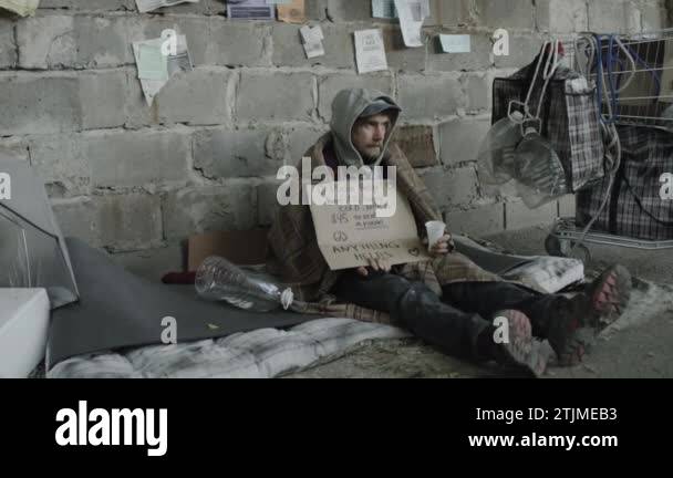 Homeless beggar man holding Stock Videos & Footage - HD and 4K Video ...