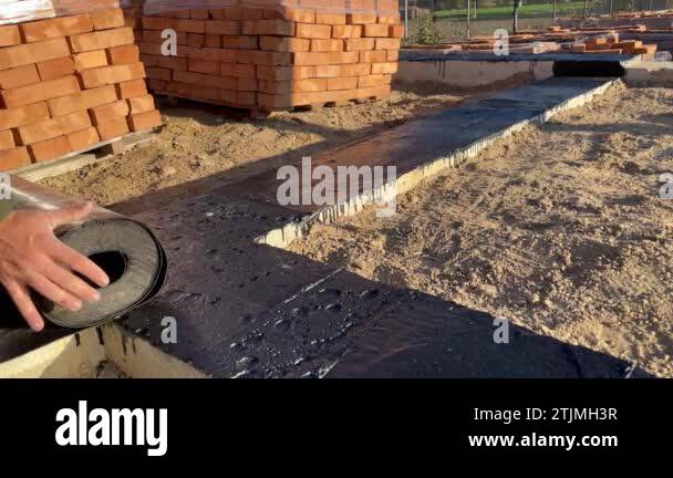 Roll waterproofing of the foundation of the building before the start ...